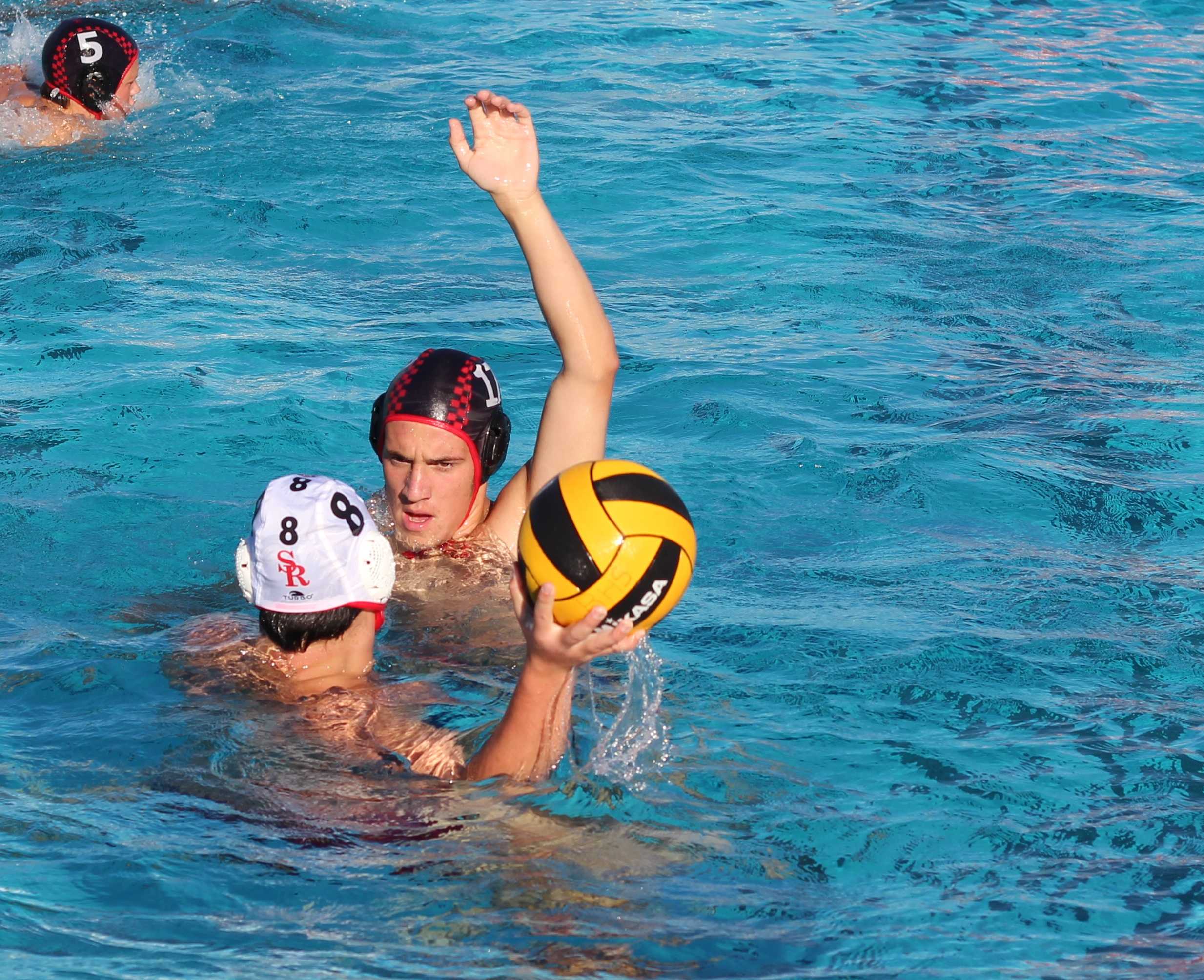Varsity water polo swims to big win over San Rafael – Redwood Bark